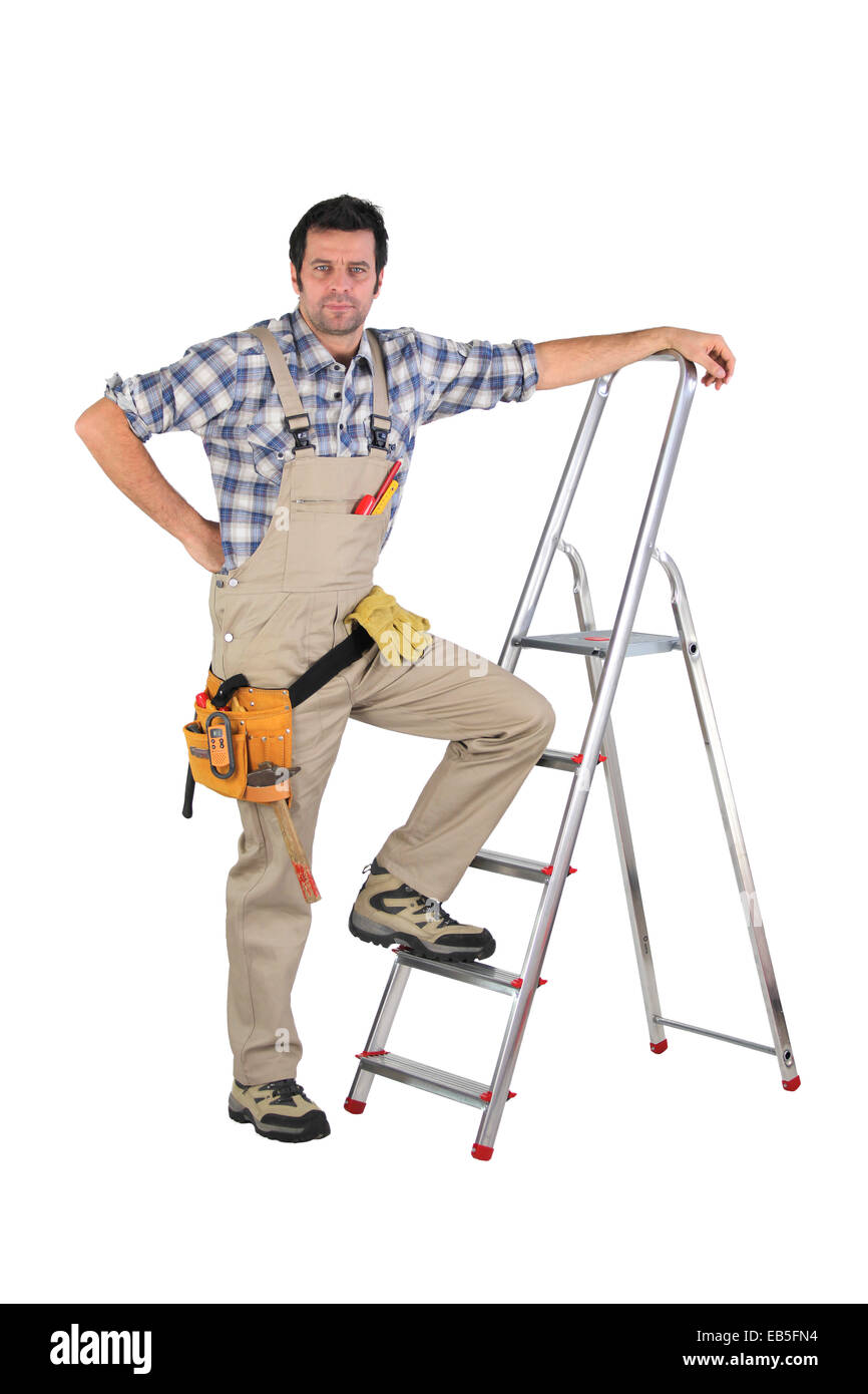 Laborer leaning on a ladder isolated on white background Stock Photo ...