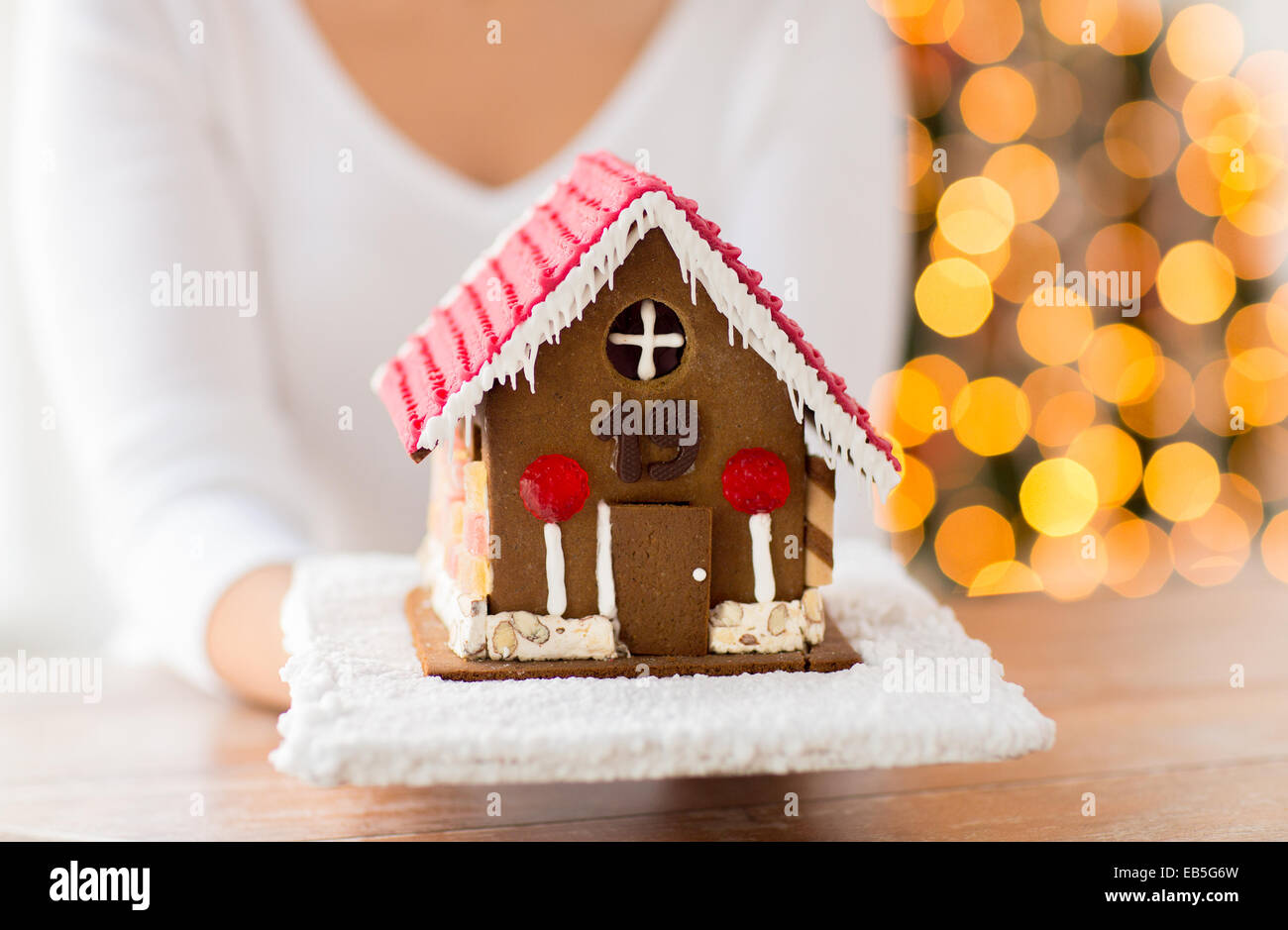 close up of woman showing gingerbread house Stock Photo - Alamy