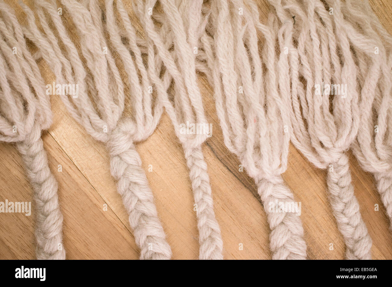 hand made woven wool braids on a wood surfaceclose up Stock Photo - Alamy