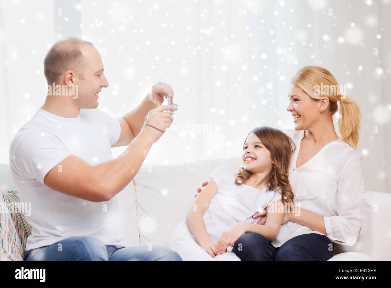 happy family with camera taking picture at home Stock Photo - Alamy