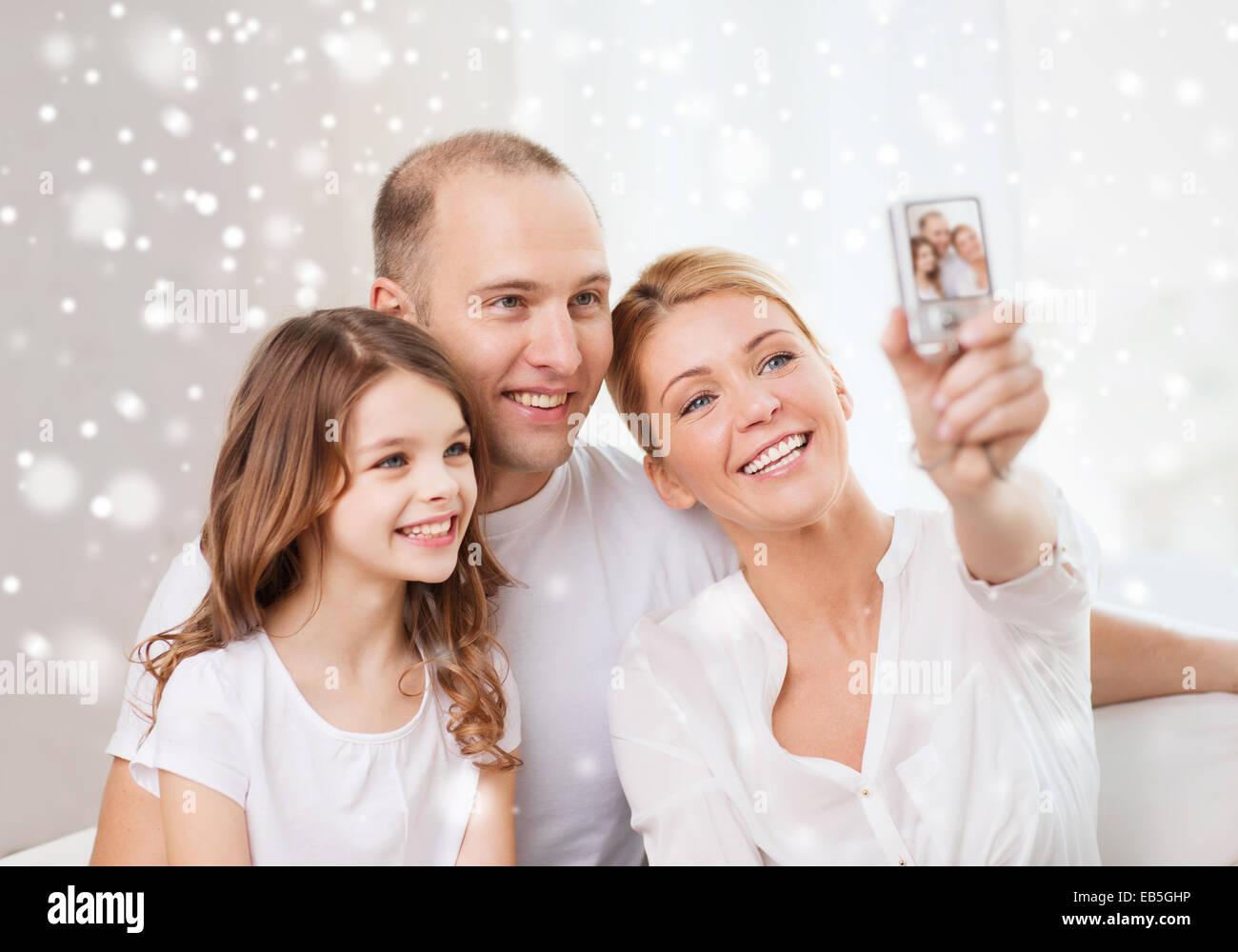 happy family with camera taking picture at home Stock Photo - Alamy