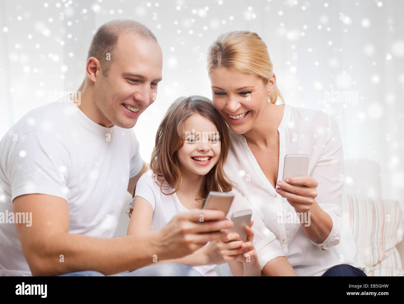 happy family with smartphones at home Stock Photo - Alamy
