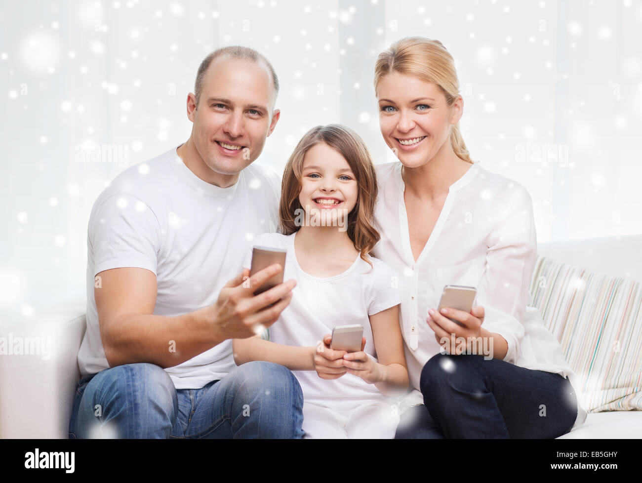 happy family with smartphones at home Stock Photo - Alamy