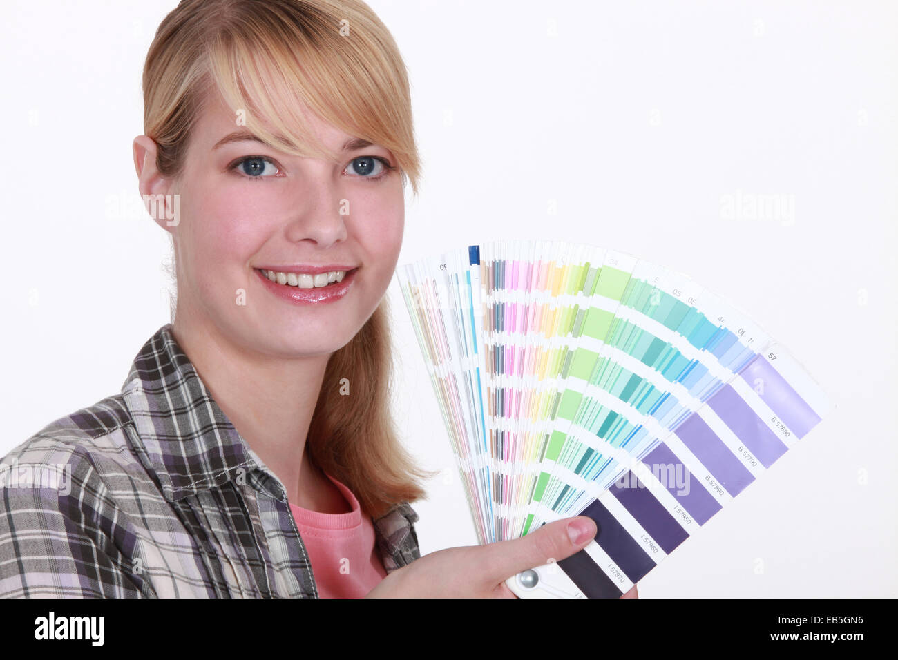 Woman with a color chart Stock Photo - Alamy