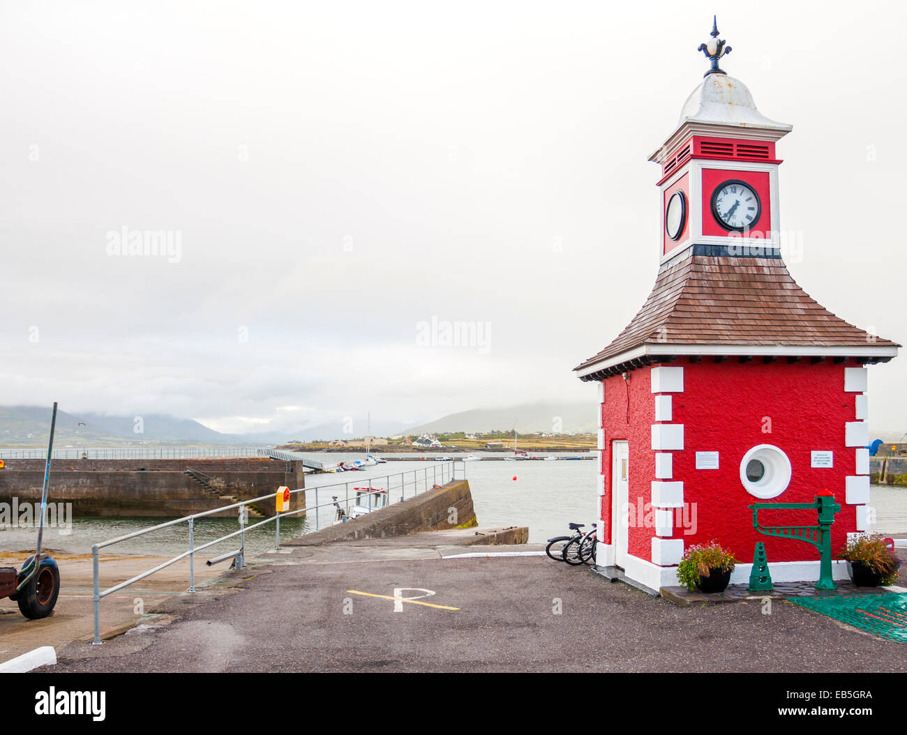 Red clock tower at the port in Knightstown, Ring of Kerry, Ireland ...