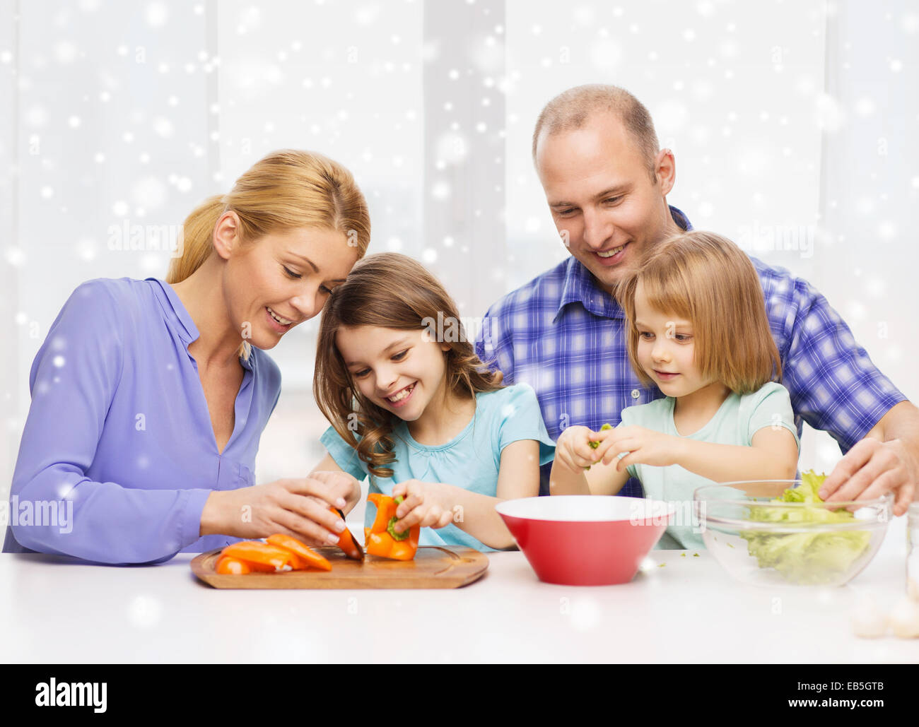 happy family with two kids making dinner at home Stock Photo - Alamy
