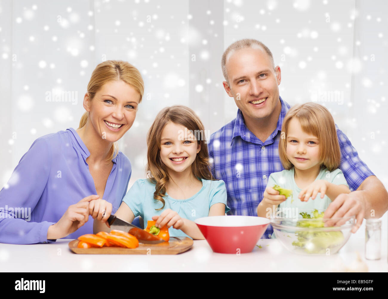 happy family with two kids making dinner at home Stock Photo - Alamy