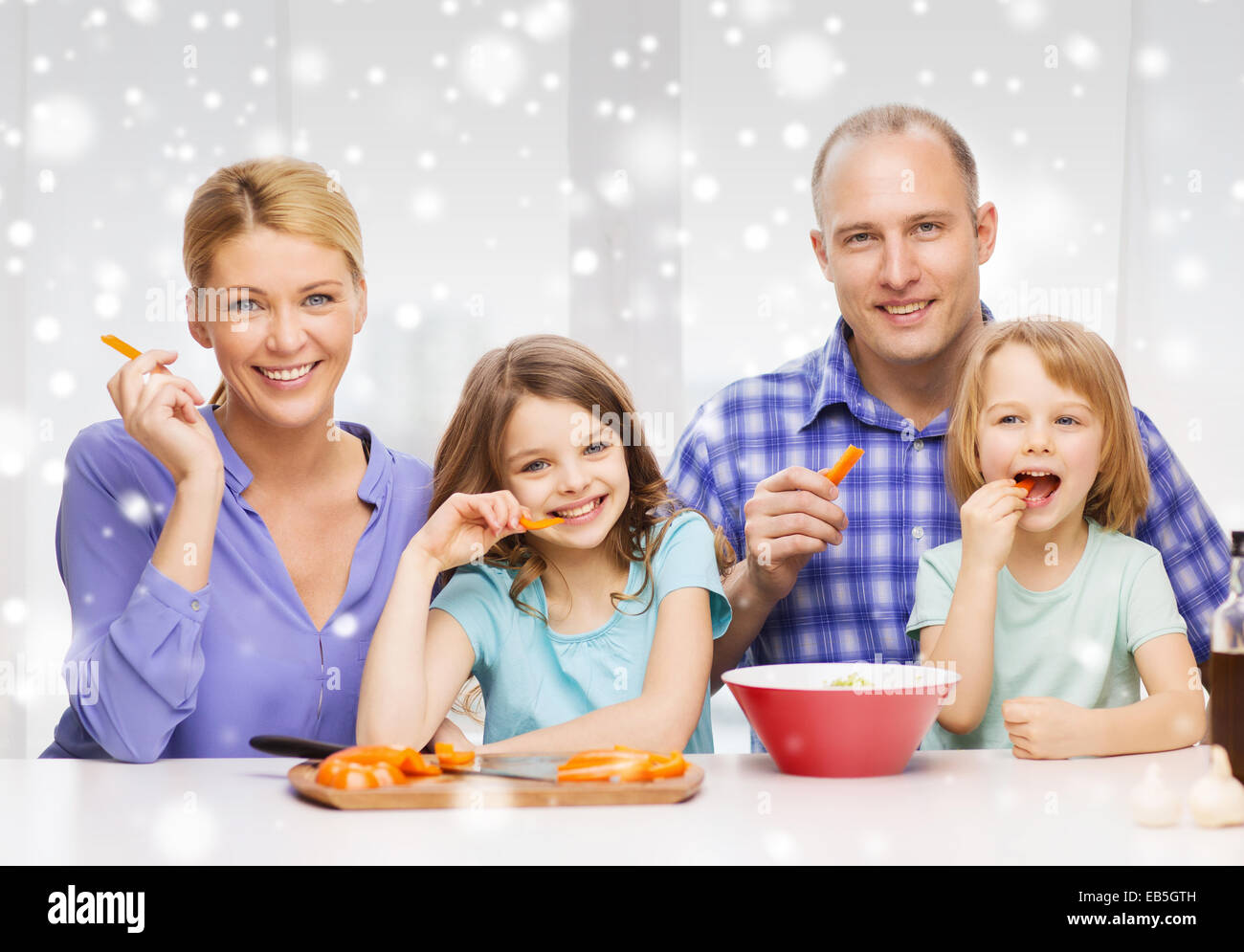 happy family with two kids making dinner at home Stock Photo - Alamy