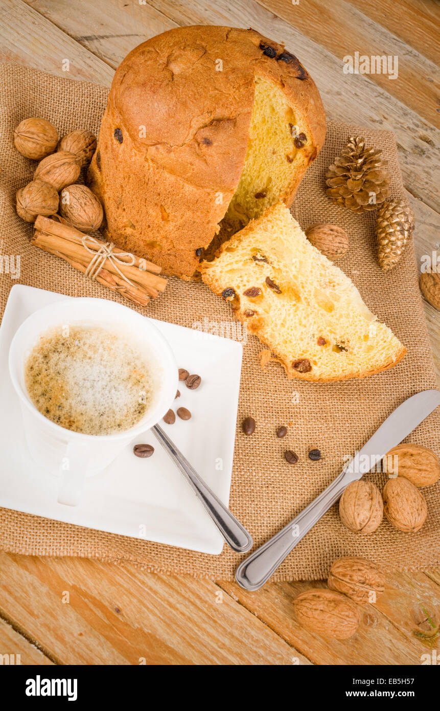 Homemade panettone with a cup of cappuccino and some ingredients Stock ...