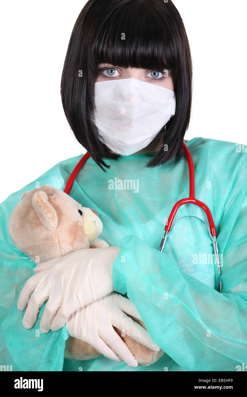 Doctor hugging a teddy bear Stock Photo - Alamy