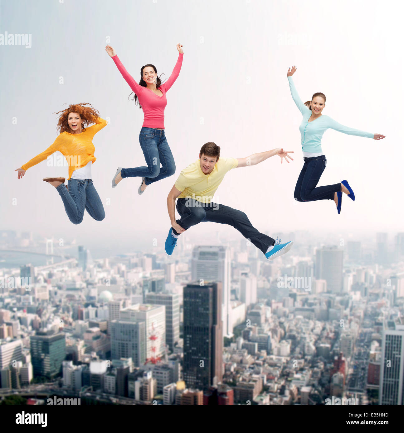 group of smiling teenagers jumping in air Stock Photo - Alamy