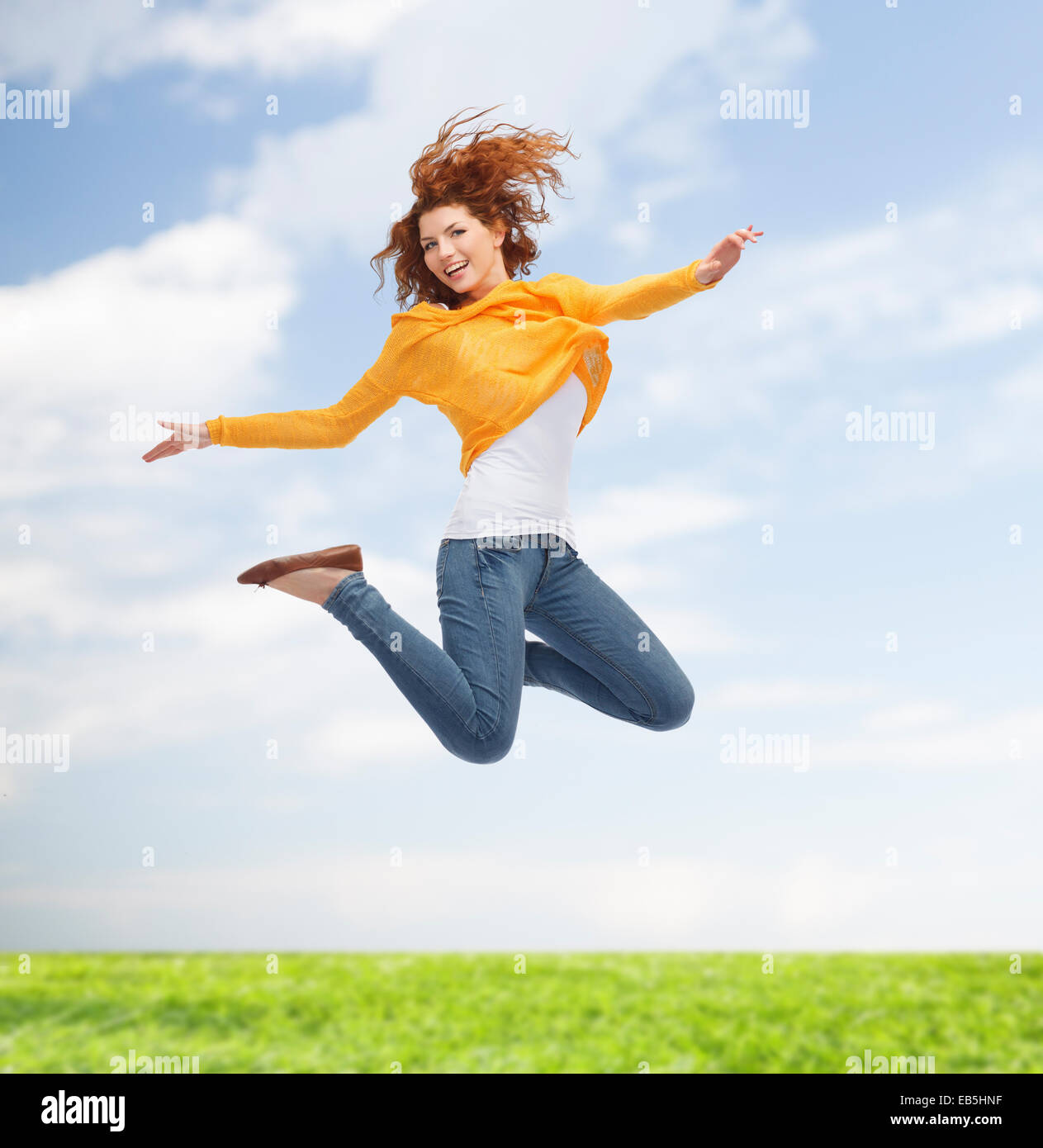 Young woman jumping high hi-res stock photography and images - Alamy