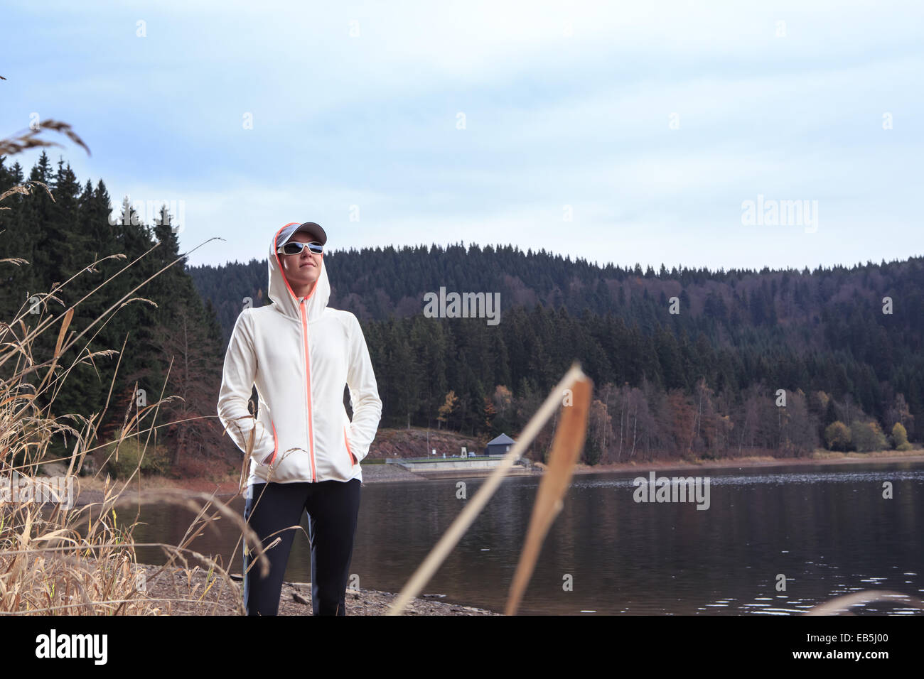woman running through the forest by the lake Stock Photo - Alamy
