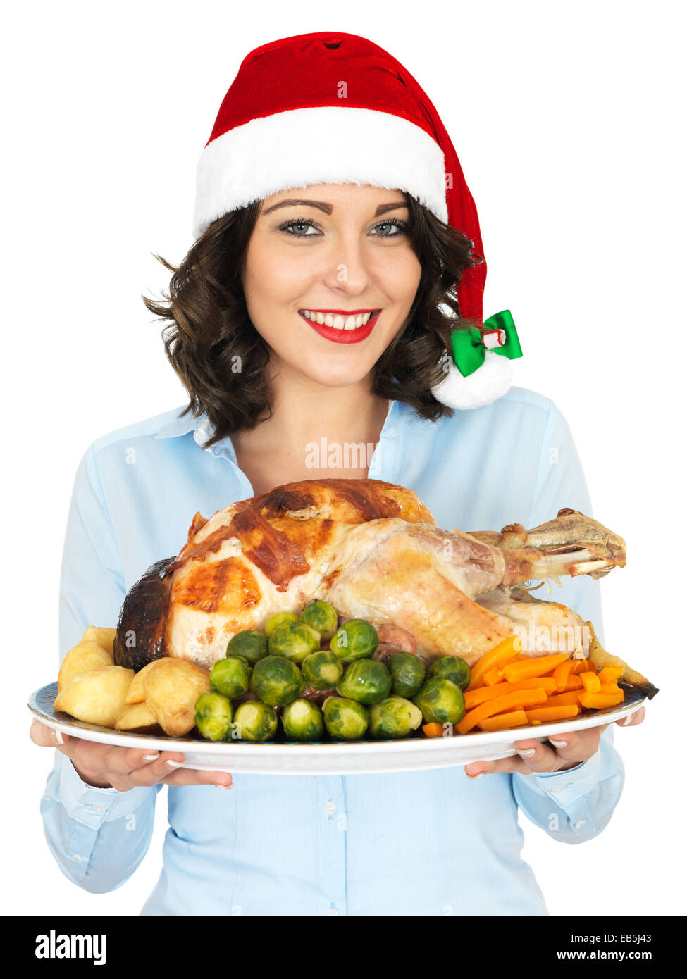 Woman smiling wearing red santa Cut Out Stock Images & Pictures - Alamy