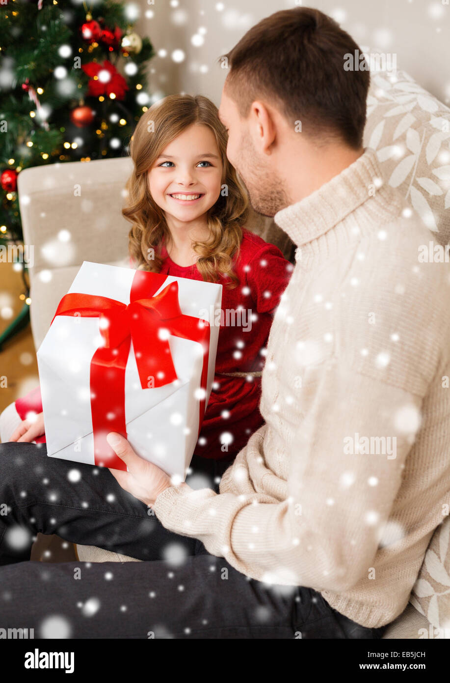 smiling father and daughter with gift box at home Stock Photo - Alamy