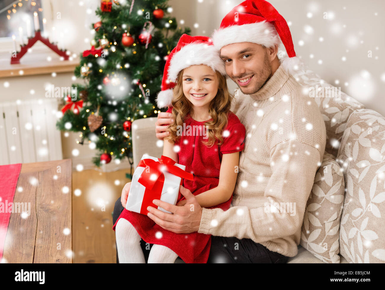 smiling father and daughter with gift box at home Stock Photo - Alamy