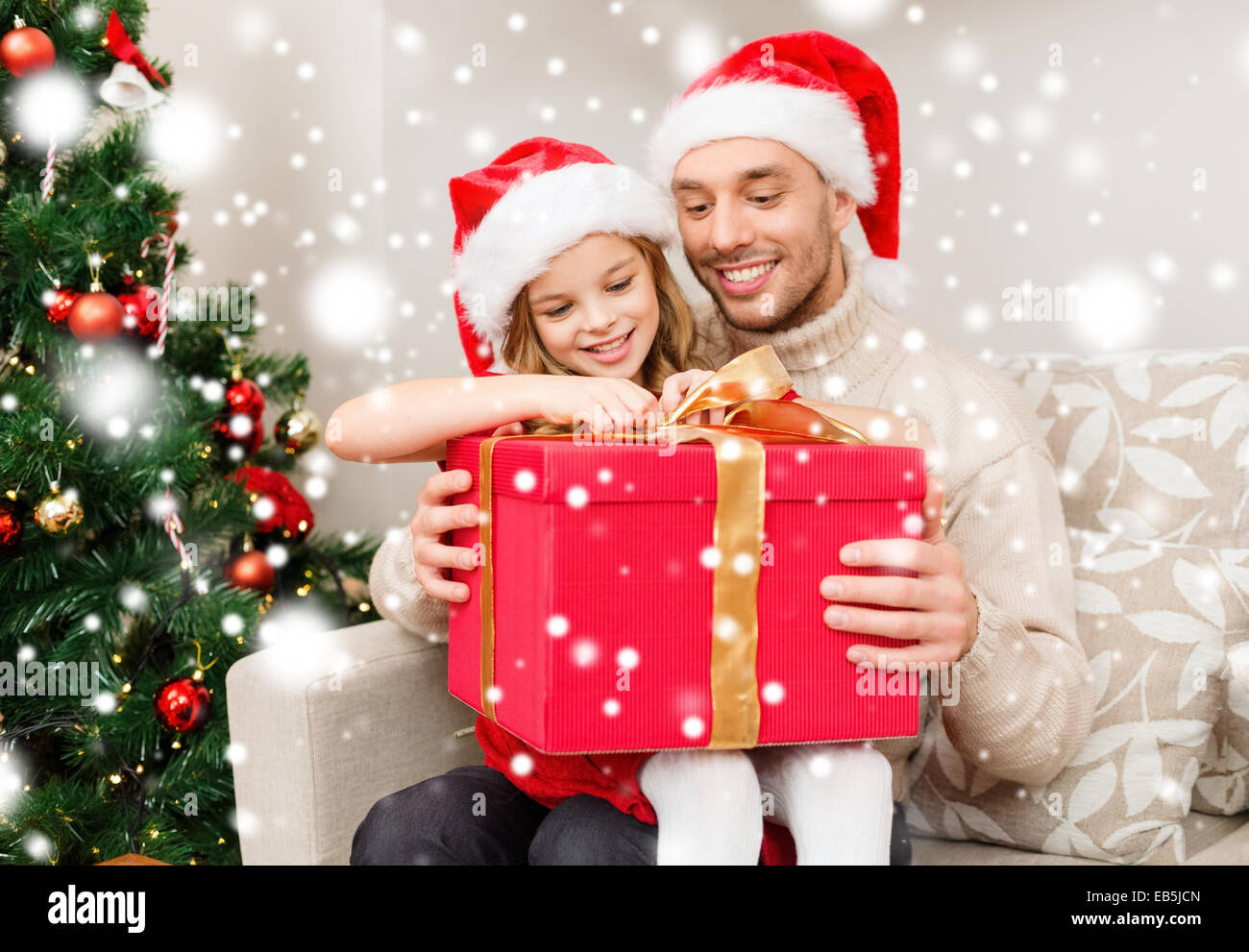 smiling father and daughter with gift box at home Stock Photo - Alamy