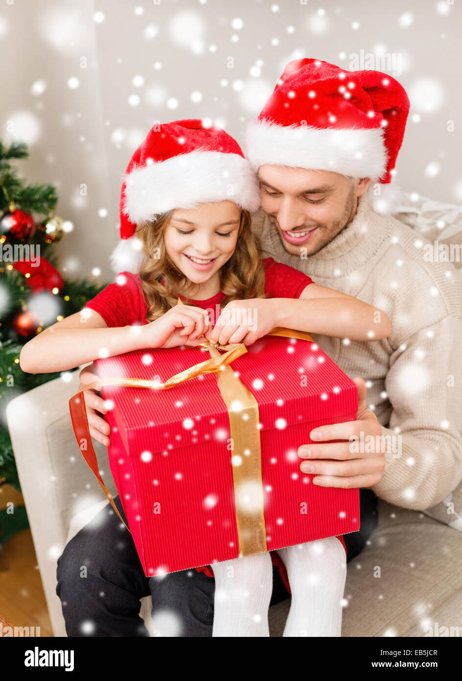 smiling father and daughter with gift box at home Stock Photo - Alamy