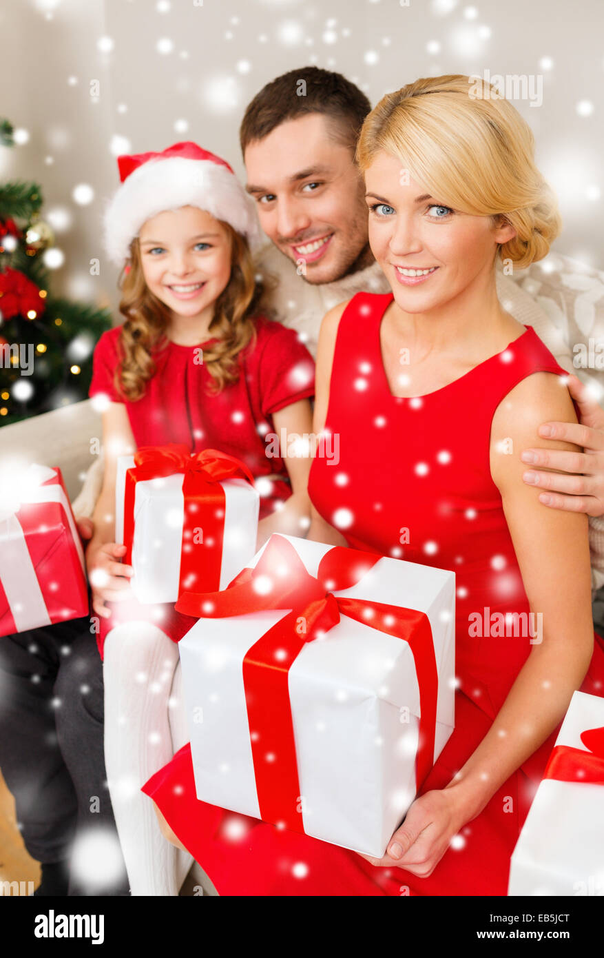 smiling family holding many gift boxes Stock Photo - Alamy