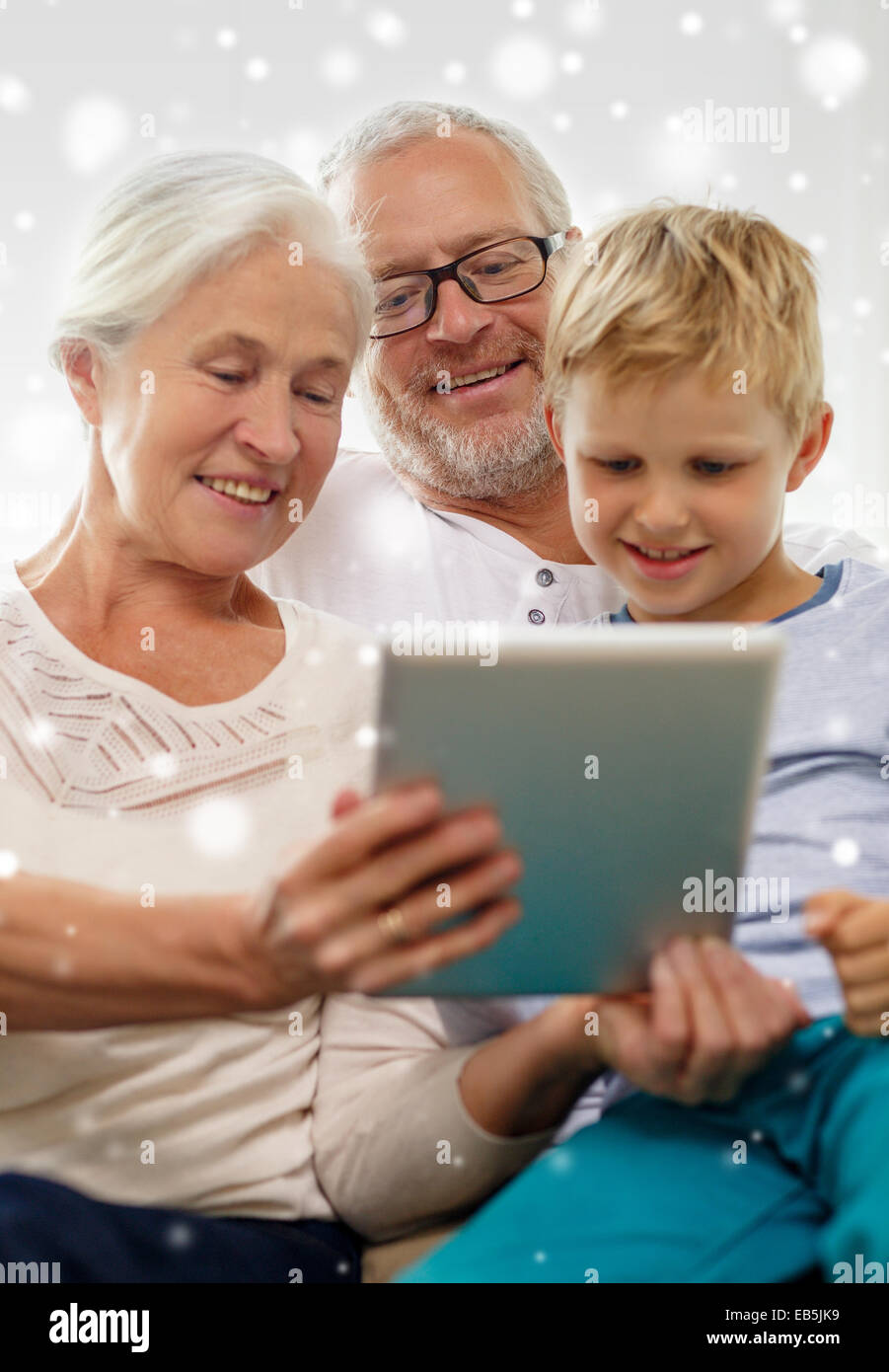 smiling family with tablet pc at home Stock Photo - Alamy