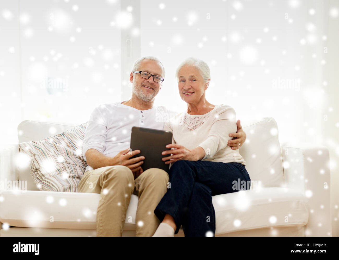 happy senior couple with tablet pc at home Stock Photo - Alamy