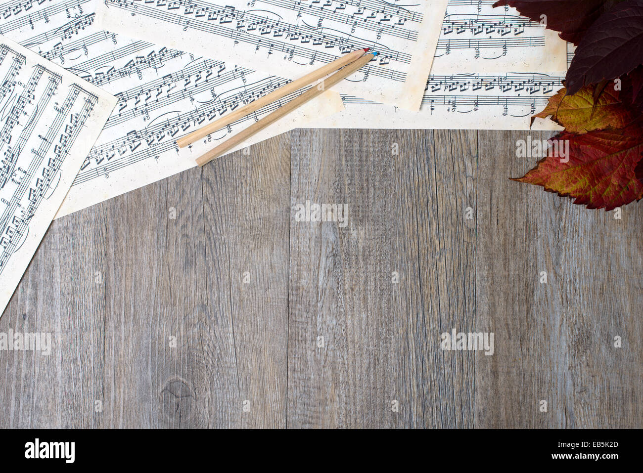musical scores with pencils on a table Stock Photo - Alamy
