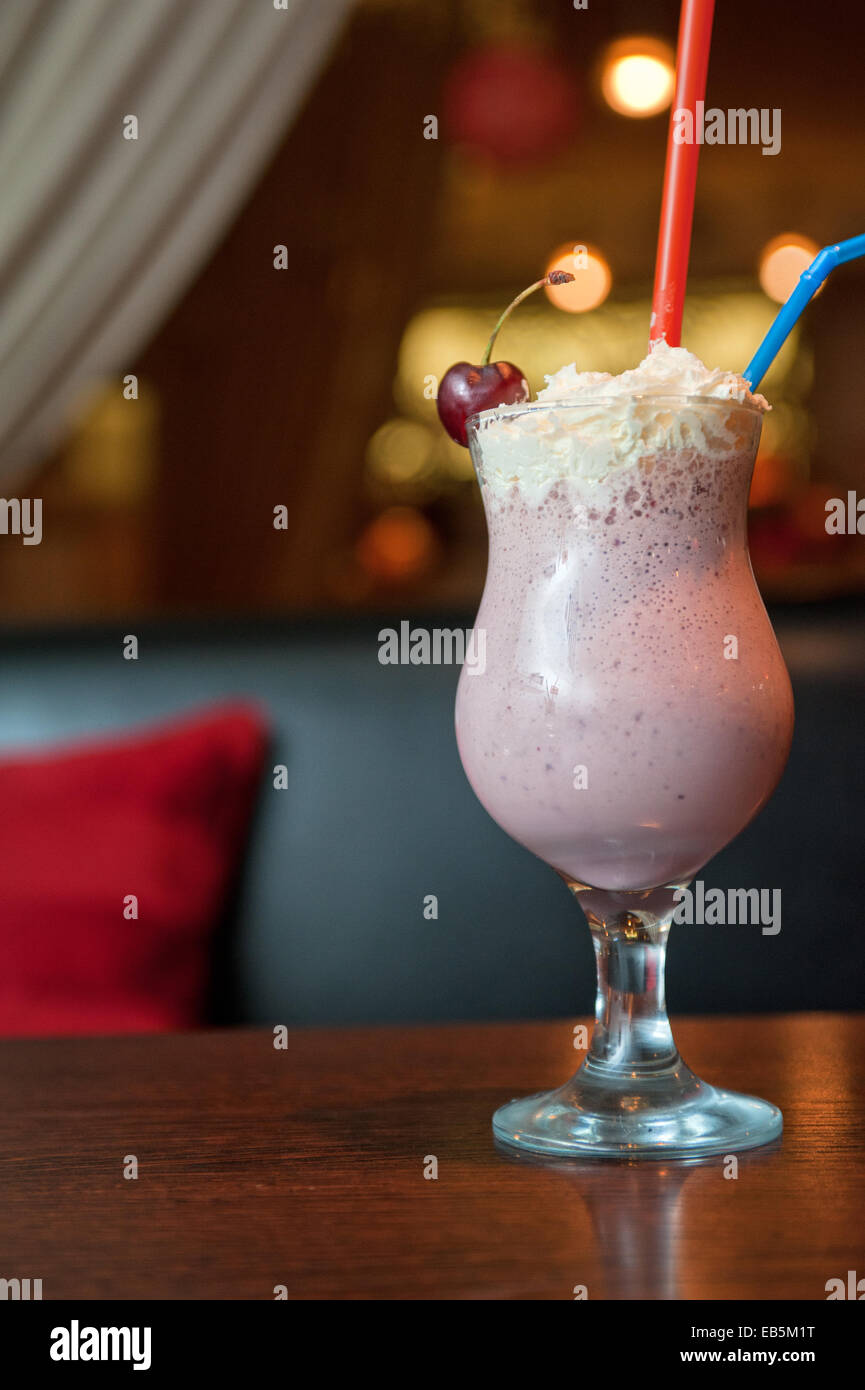 Cherry milkshake with fresh fruits Stock Photo - Alamy