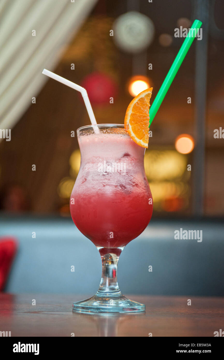 berry milkshake with orange fruit Stock Photo - Alamy