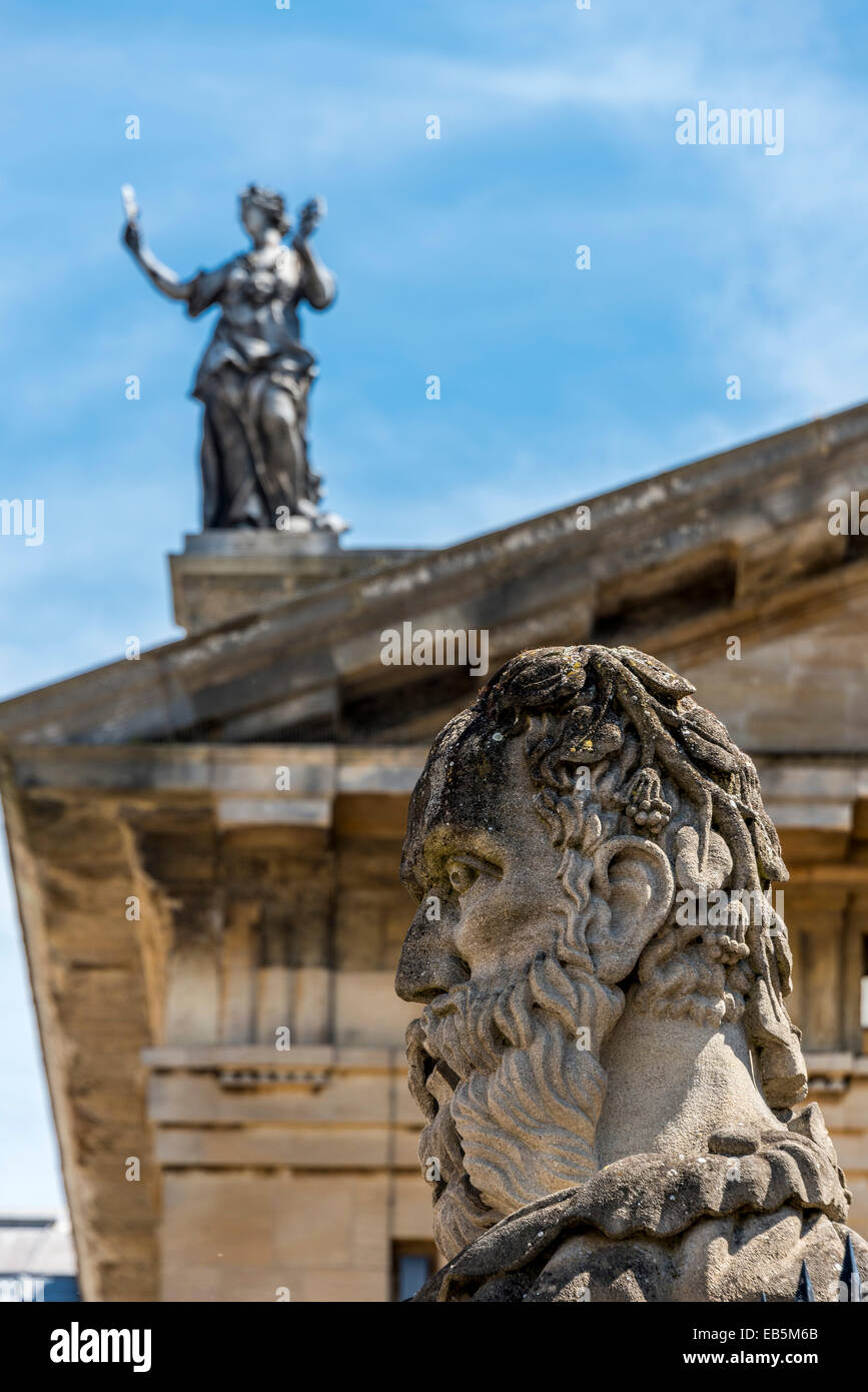 Grotesque decorative stone figure heads outside the Sheldonian Theatre ...