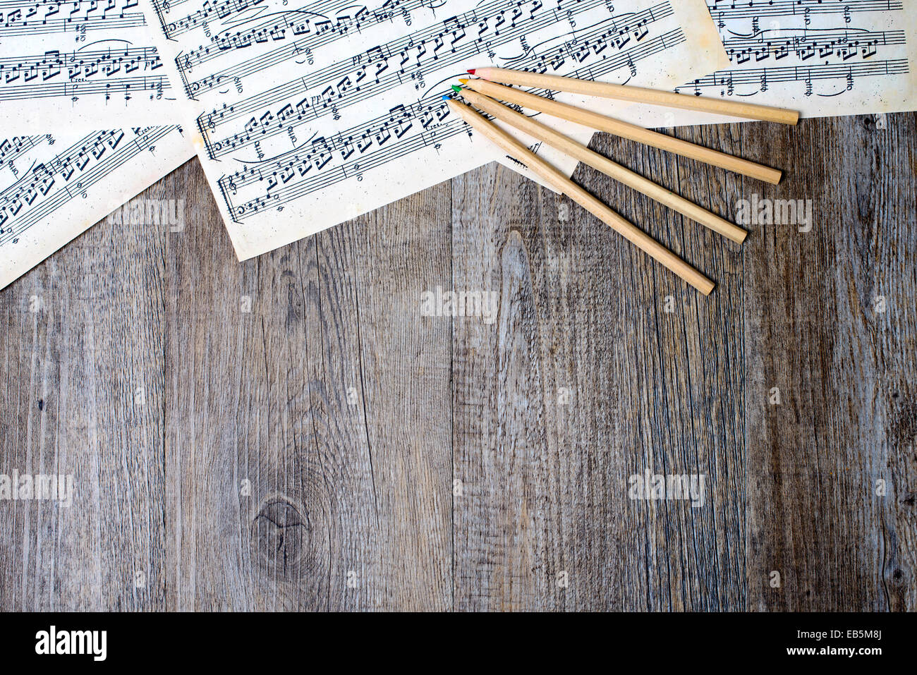 musical scores with pencils on a table Stock Photo - Alamy