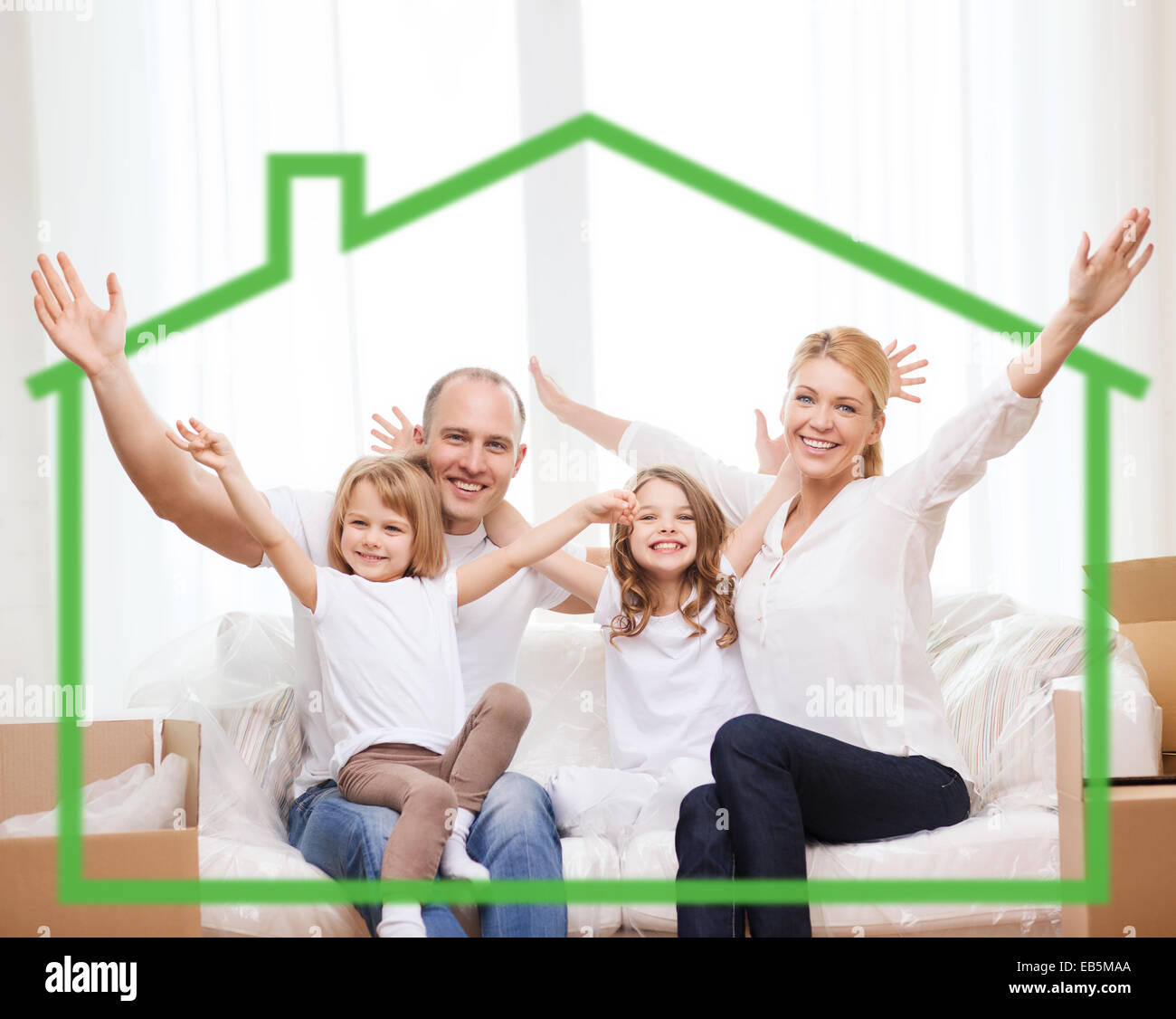 smiling parents and two little girls at new home Stock Photo - Alamy