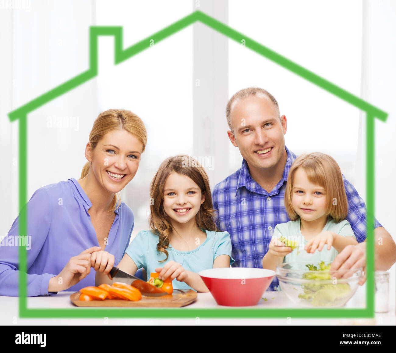 happy family with two kids making dinner at home Stock Photo - Alamy