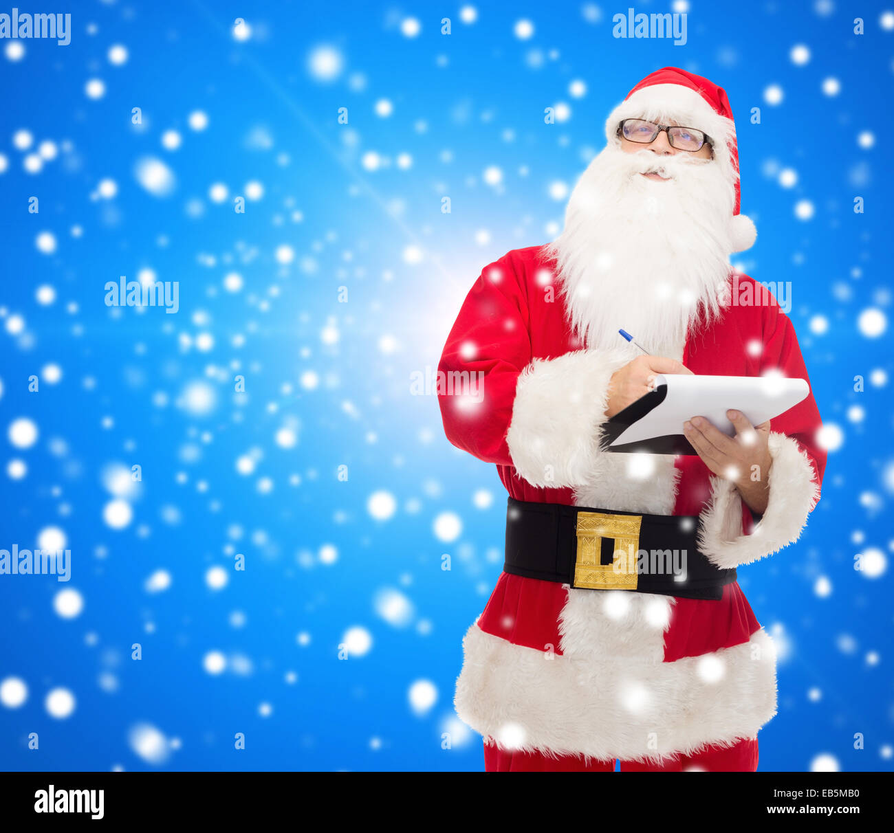 man in costume of santa claus with notepad Stock Photo - Alamy