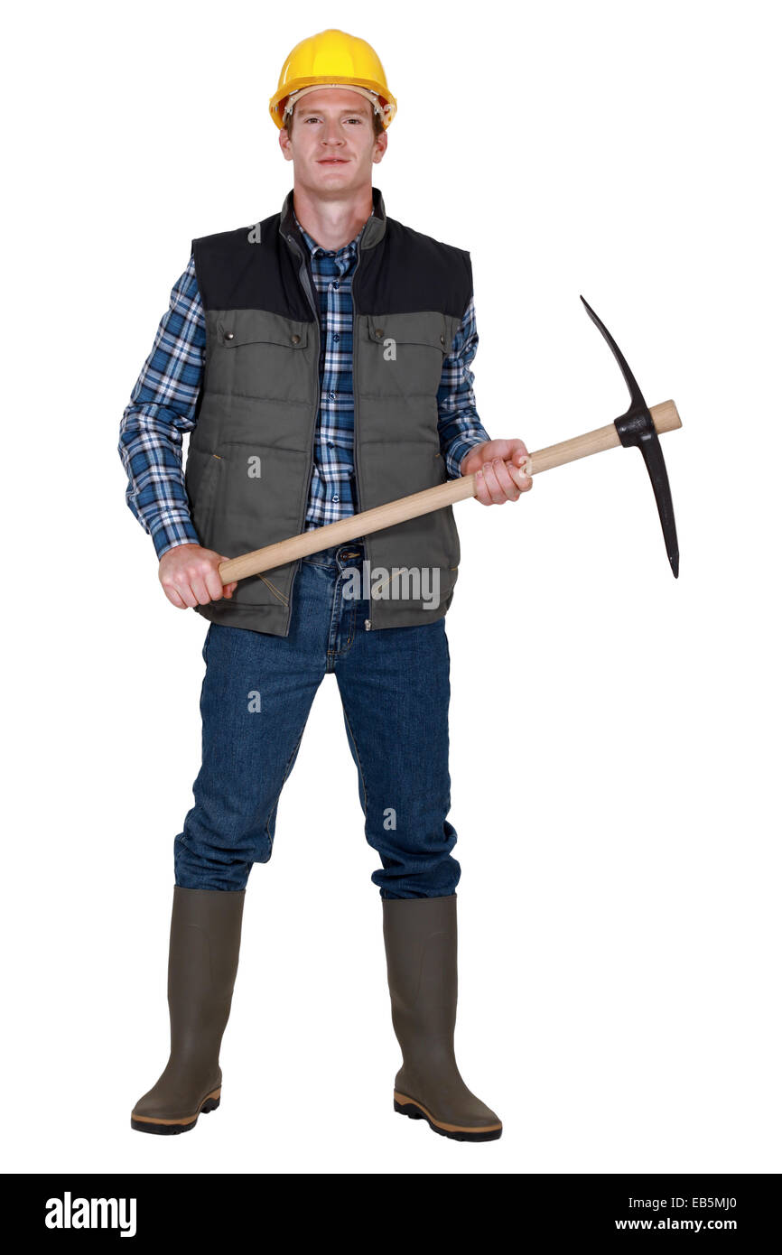 Man stood with pick ax Stock Photo - Alamy