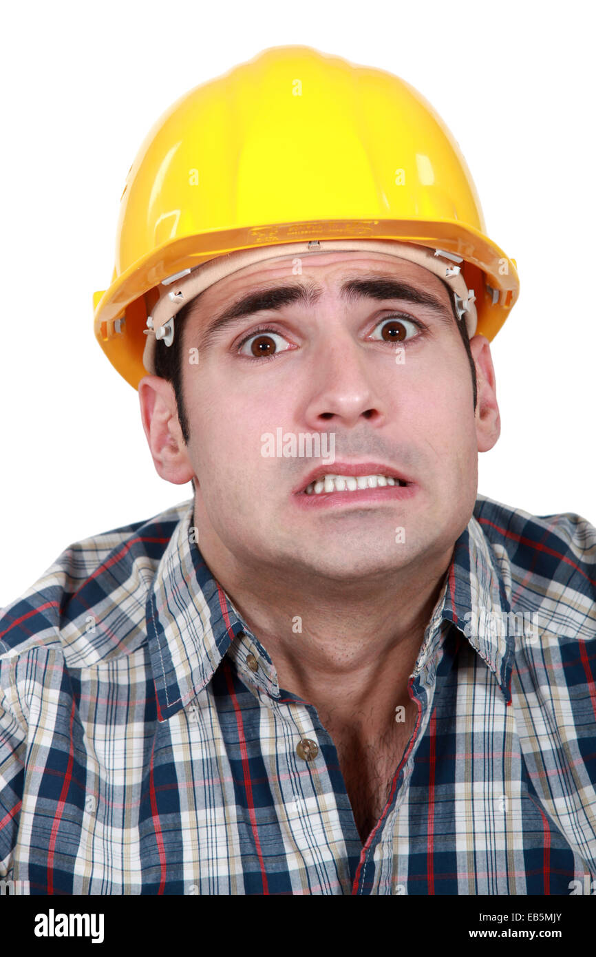 craftsman looking frightened Stock Photo - Alamy