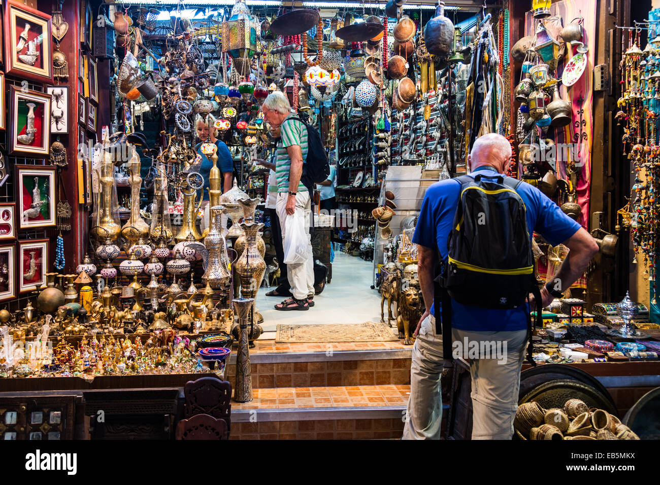 Western tourists shopping in souvenir stores at the Souq Muttrah ...