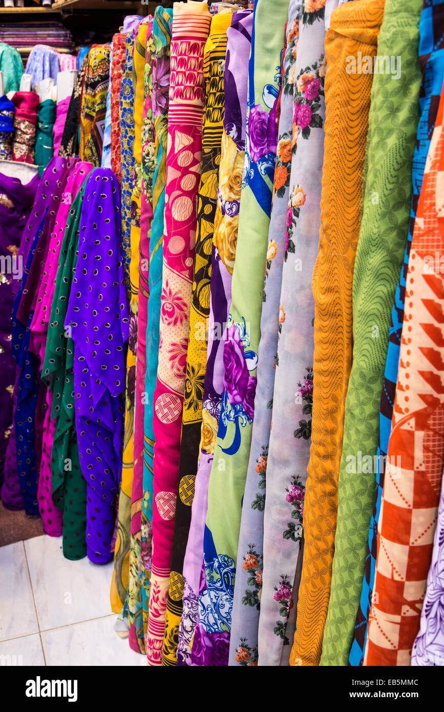 Rolls colorful textiles in a store at the Souq Muttrah, Muscat, Oman ...