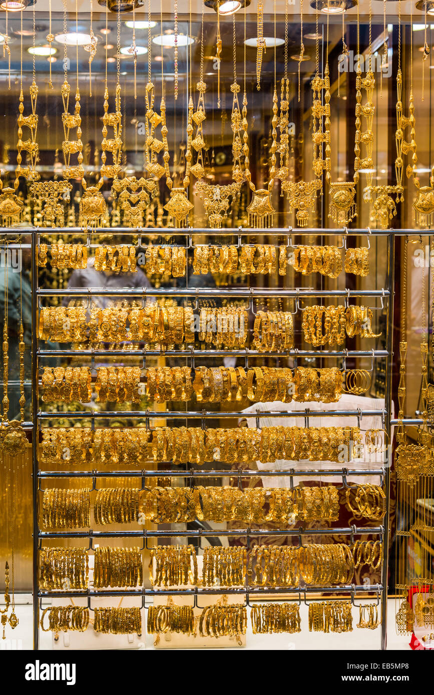 Gold jewelries displayed in a store window. Souq Muttrah, Muscat, Oman ...