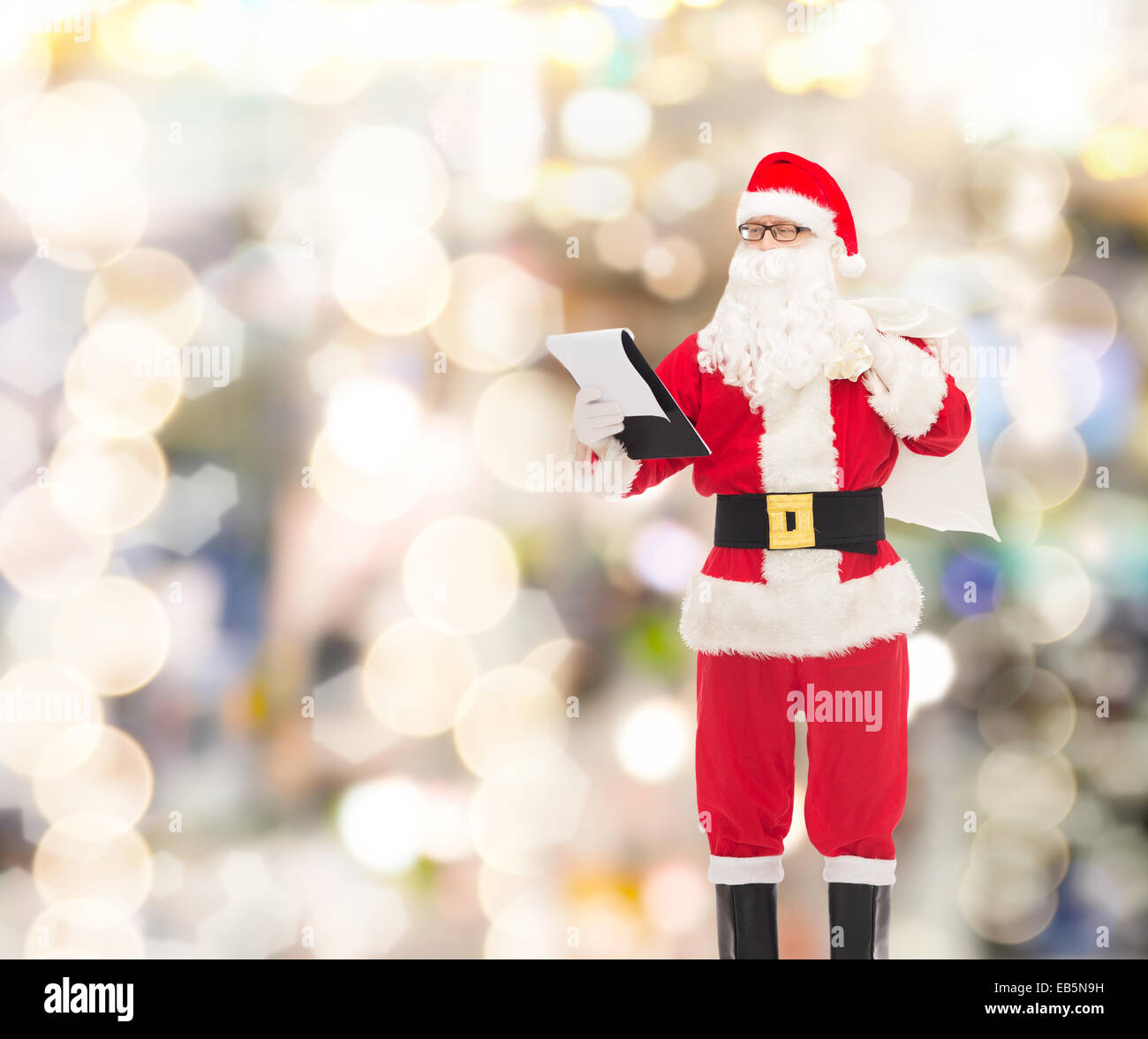 man in costume of santa claus with notepad and bag Stock Photo - Alamy