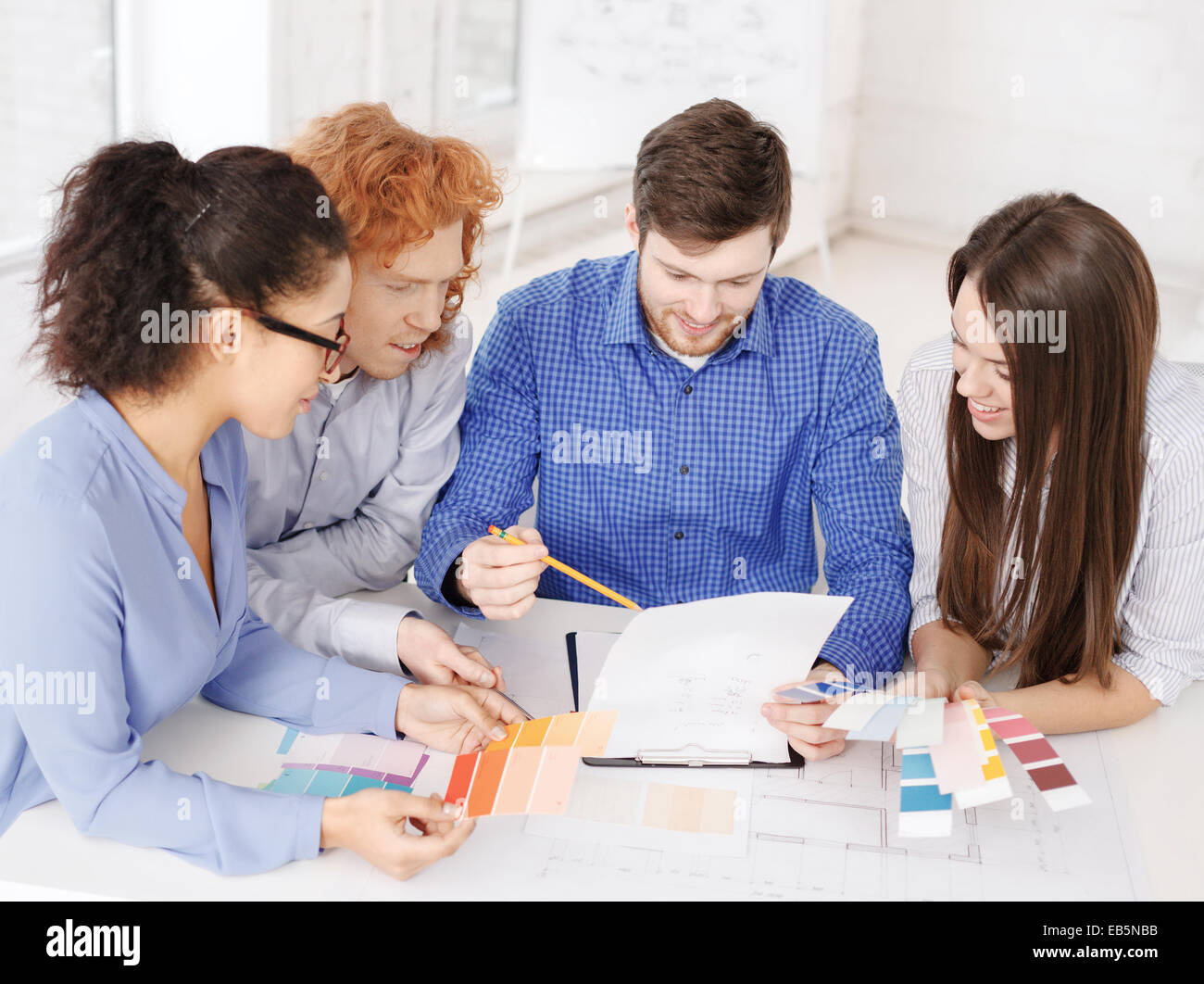 team with color samples and blueprint at office Stock Photo - Alamy