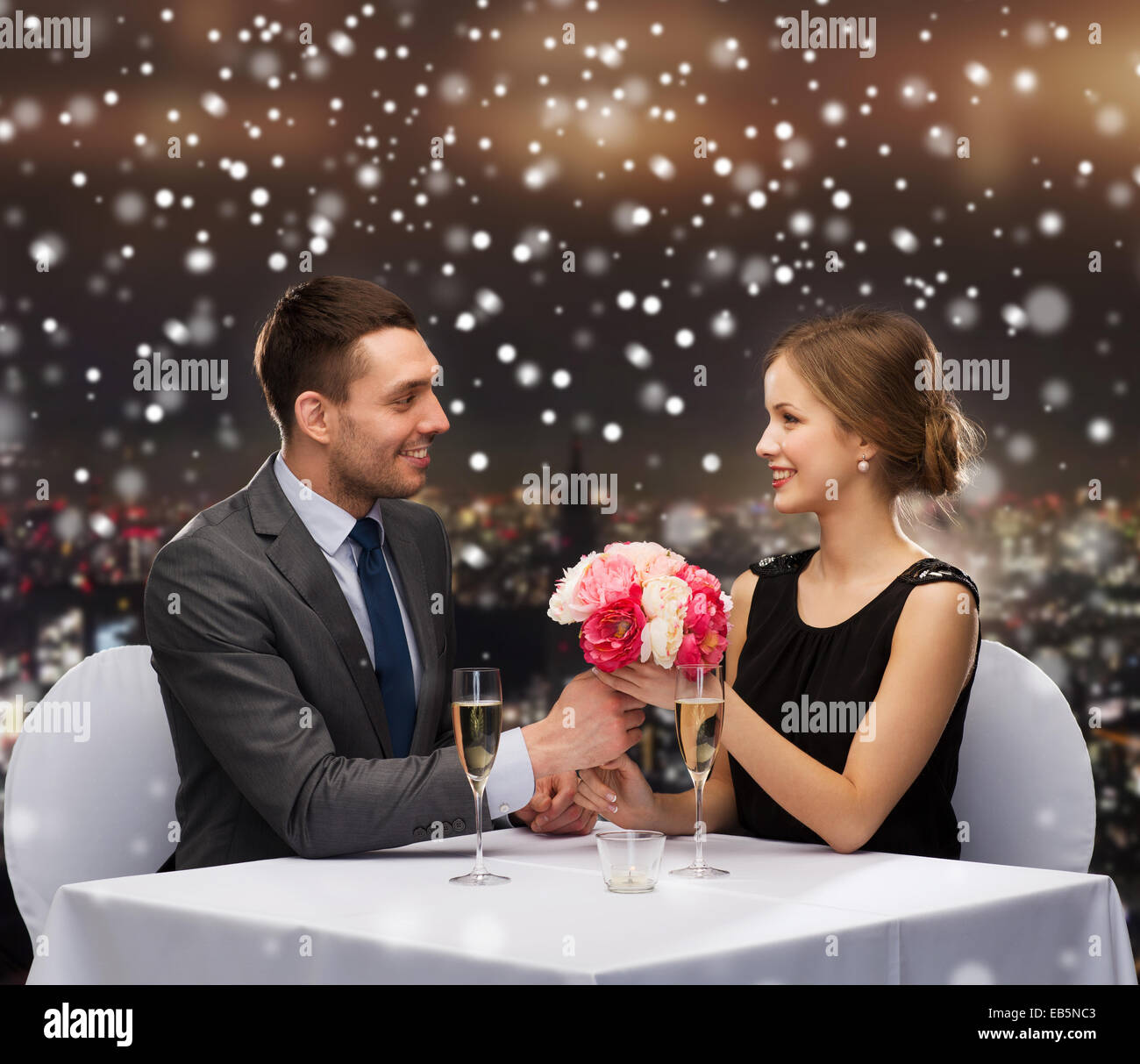 smiling couple at restaurant Stock Photo - Alamy