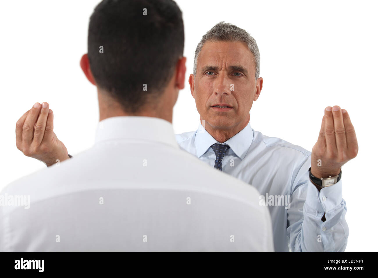 Angry boss talking to employee Stock Photo - Alamy