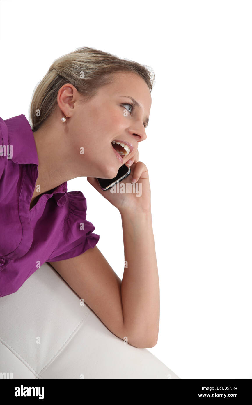 Woman sat on couch Stock Photo - Alamy