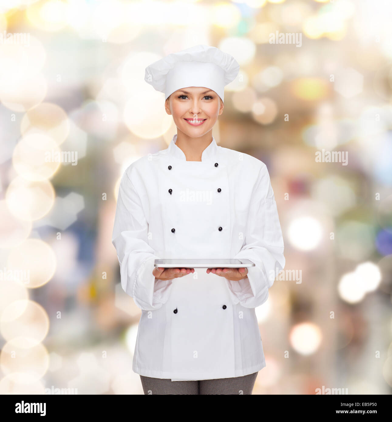 smiling female chef with tablet pc computer Stock Photo - Alamy