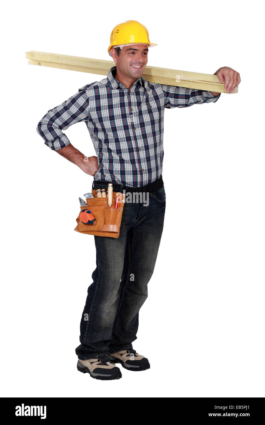 Happy carpenter standing on white background Stock Photo - Alamy