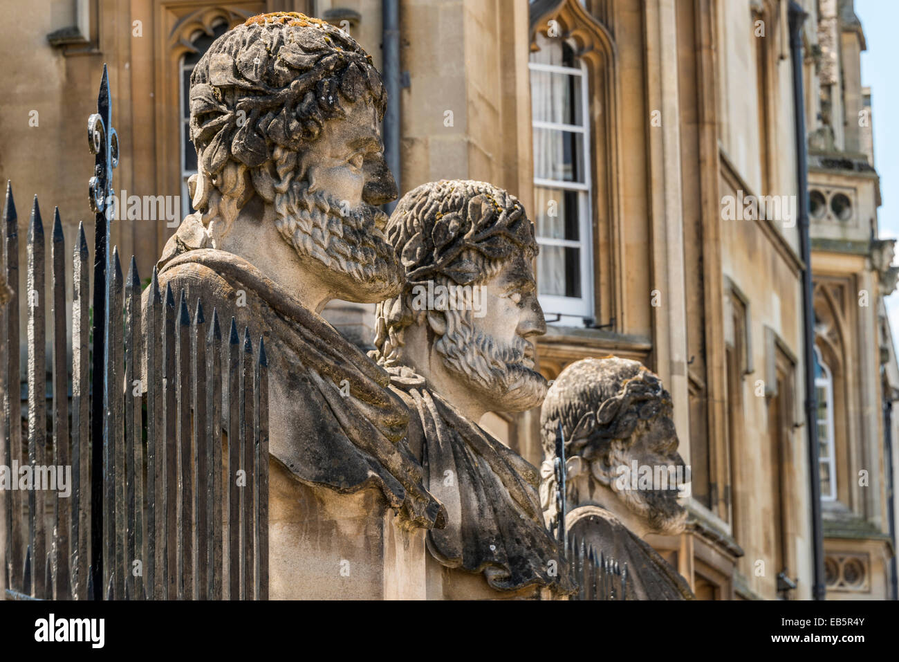 Grotesque decorative stone figure heads outside the Sheldonian Theatre ...