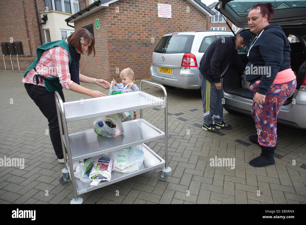 A family receiving food at Epsom Foodbank, food donations for families ...