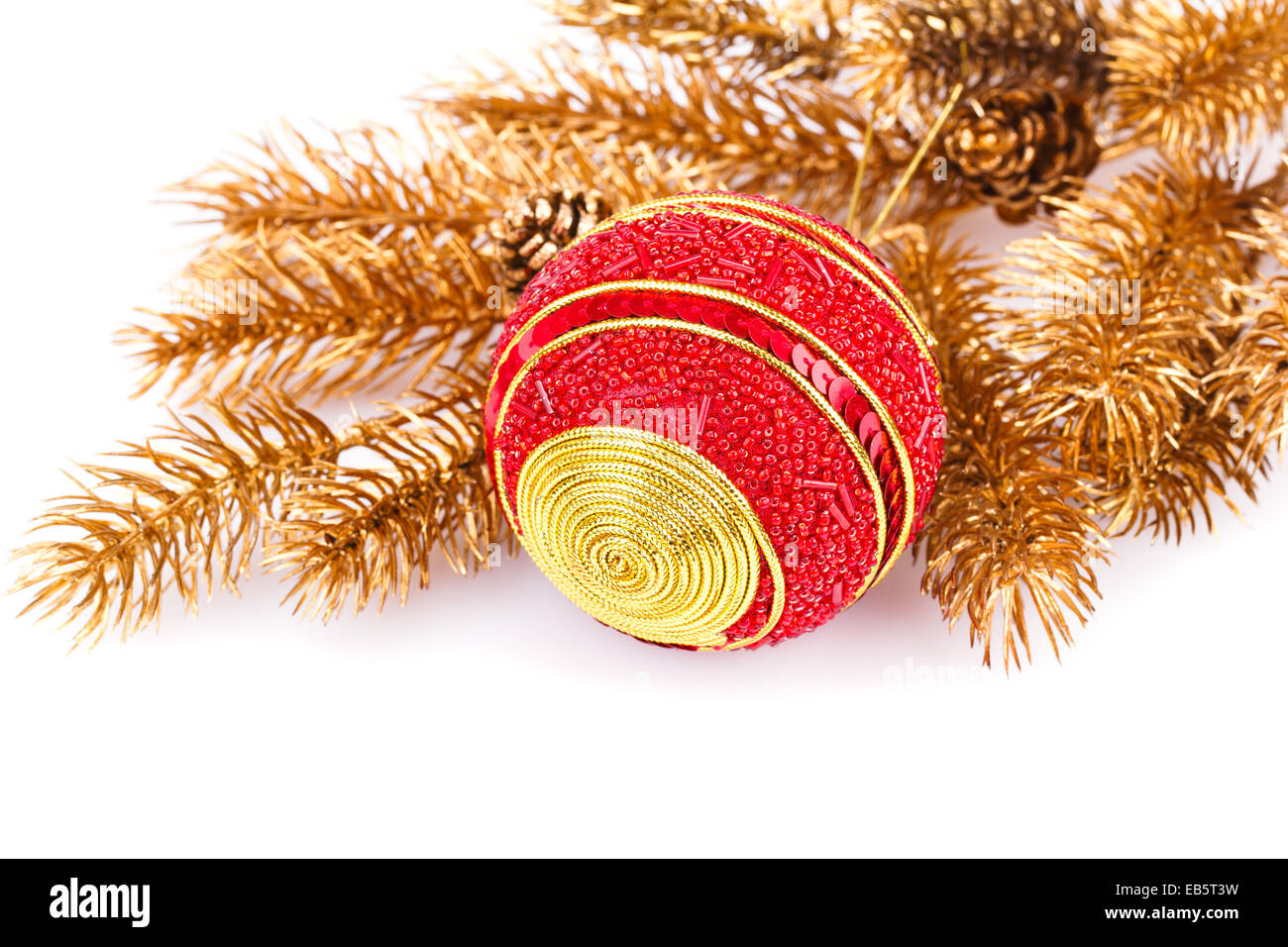 Christmas decoration with ball and golden fir tree branch isolated on ...
