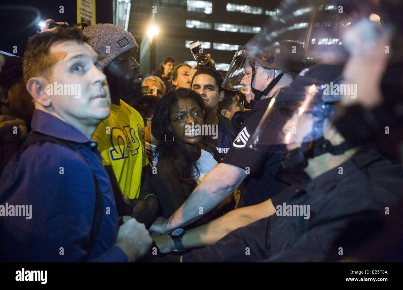 Los Angeles, California, USA. 25th Nov, 2014. Police officers confront ...