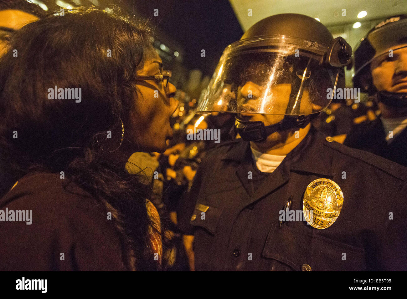 Los Angeles, California, USA. 25th Nov, 2014. Police officers confront ...